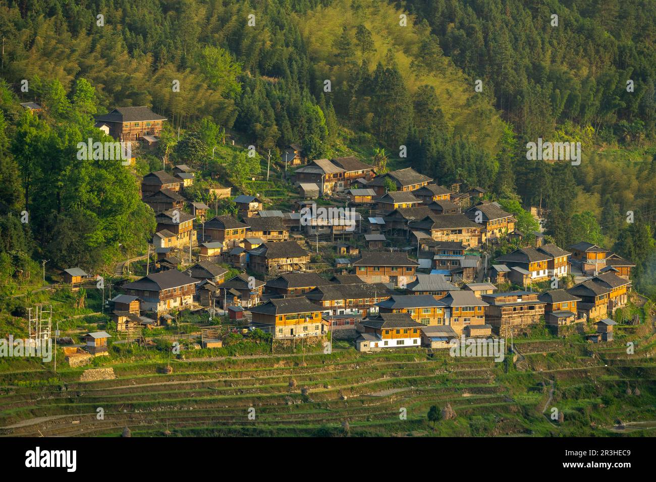 village houses and terrace fields on mountains in sunset Stock Photo ...