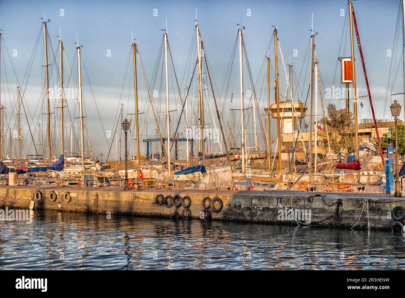 Sailing and engine boats in the harbour channel Stock Photo - Alamy