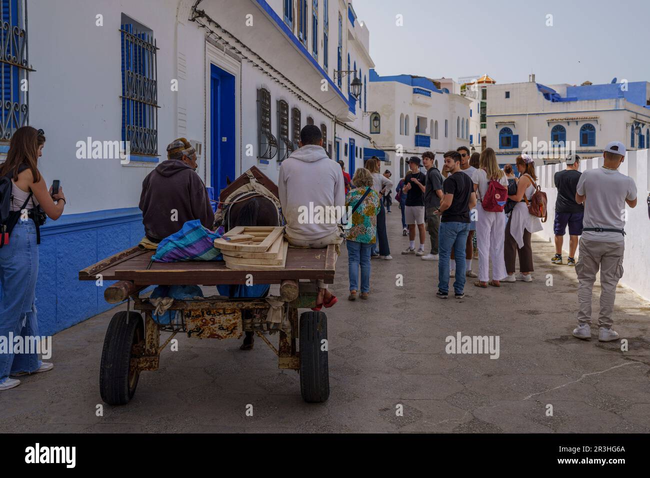 horse drawn carriage among crowd of tourists, Asilah, morocco, africa ...