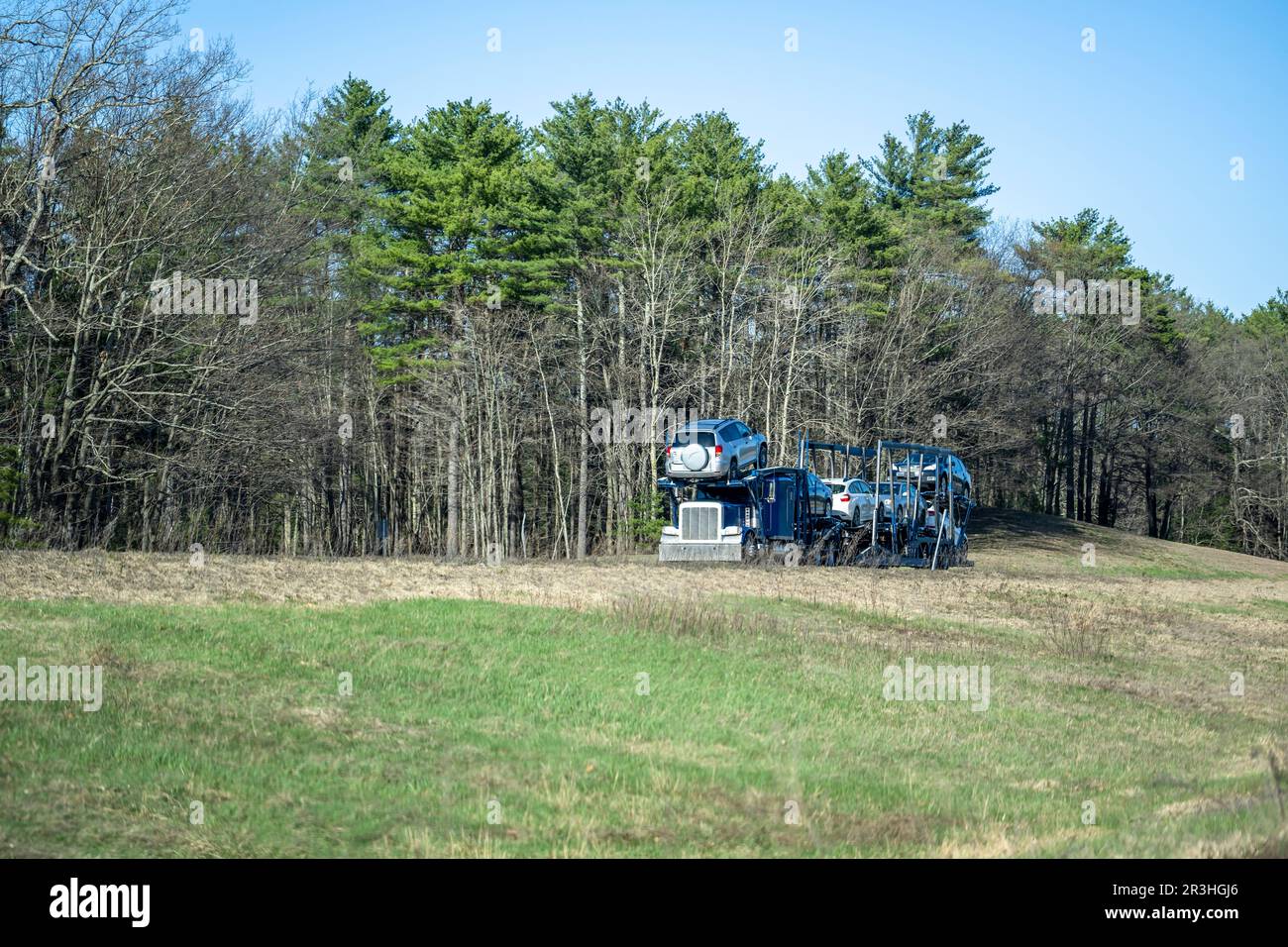 Classic blue big rig car hauler industrial semi truck tractor ...