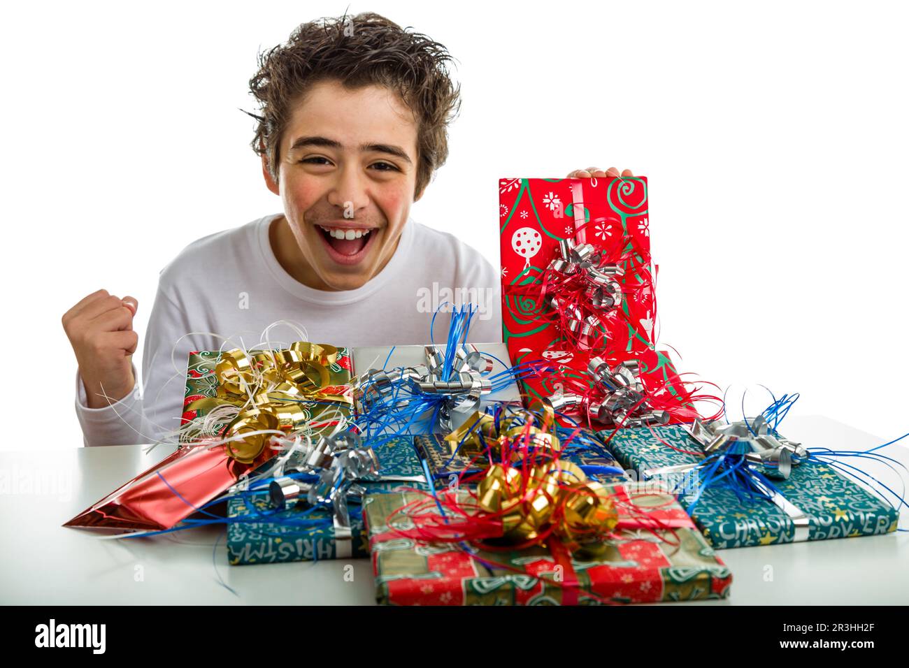 Happy boy smiles receiving Christmas gifts Stock Photo - Alamy