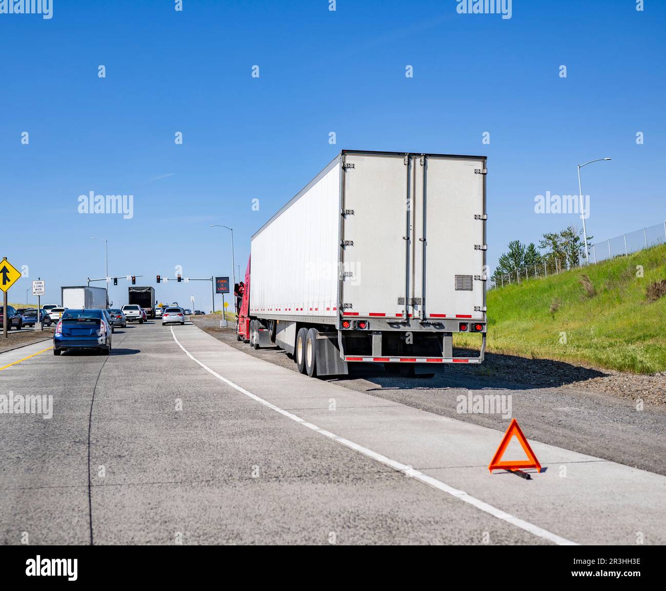 Broken red big rig industrial standard semi truck tractor with open ...