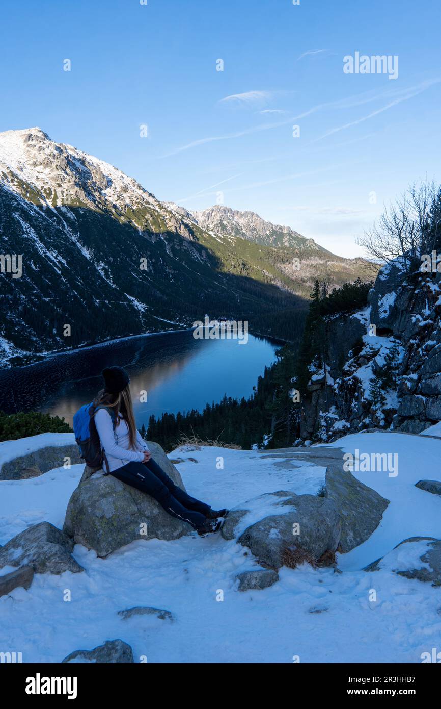 Tourist woman near the mountain lake Morskie Oko in Tatra National Park ...