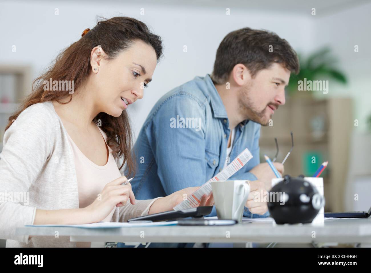 Couple finances happy receipt hi-res stock photography and images - Alamy