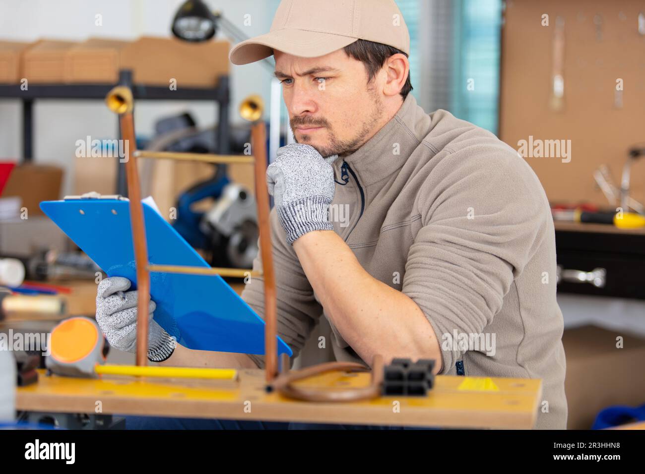 handsome young lumber cutting copper pipe Stock Photo - Alamy
