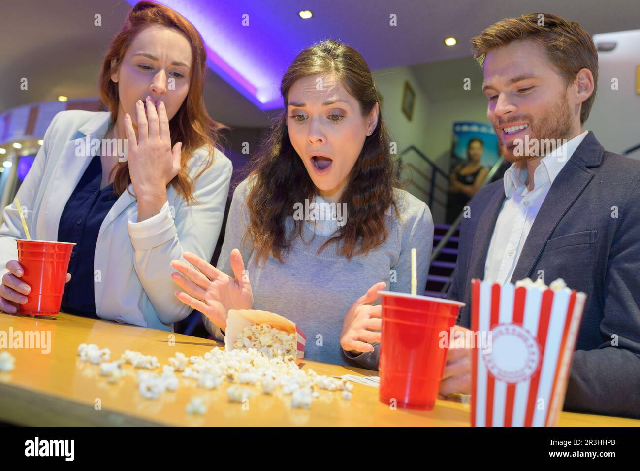 woman dropped the pop corns Stock Photo - Alamy