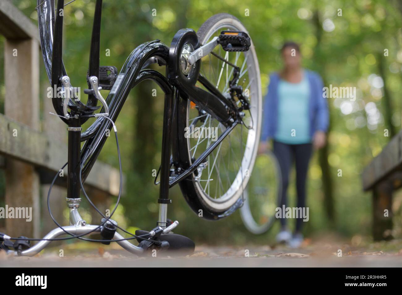 man walking towards broken down bicycle Stock Photo - Alamy