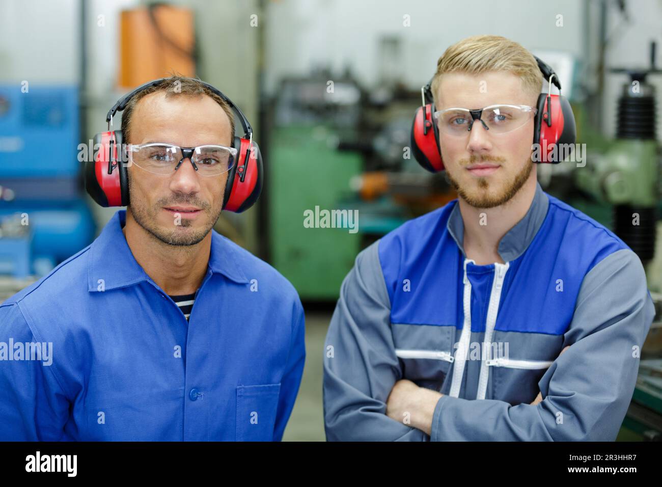 blue collar workers looking at camera Stock Photo - Alamy