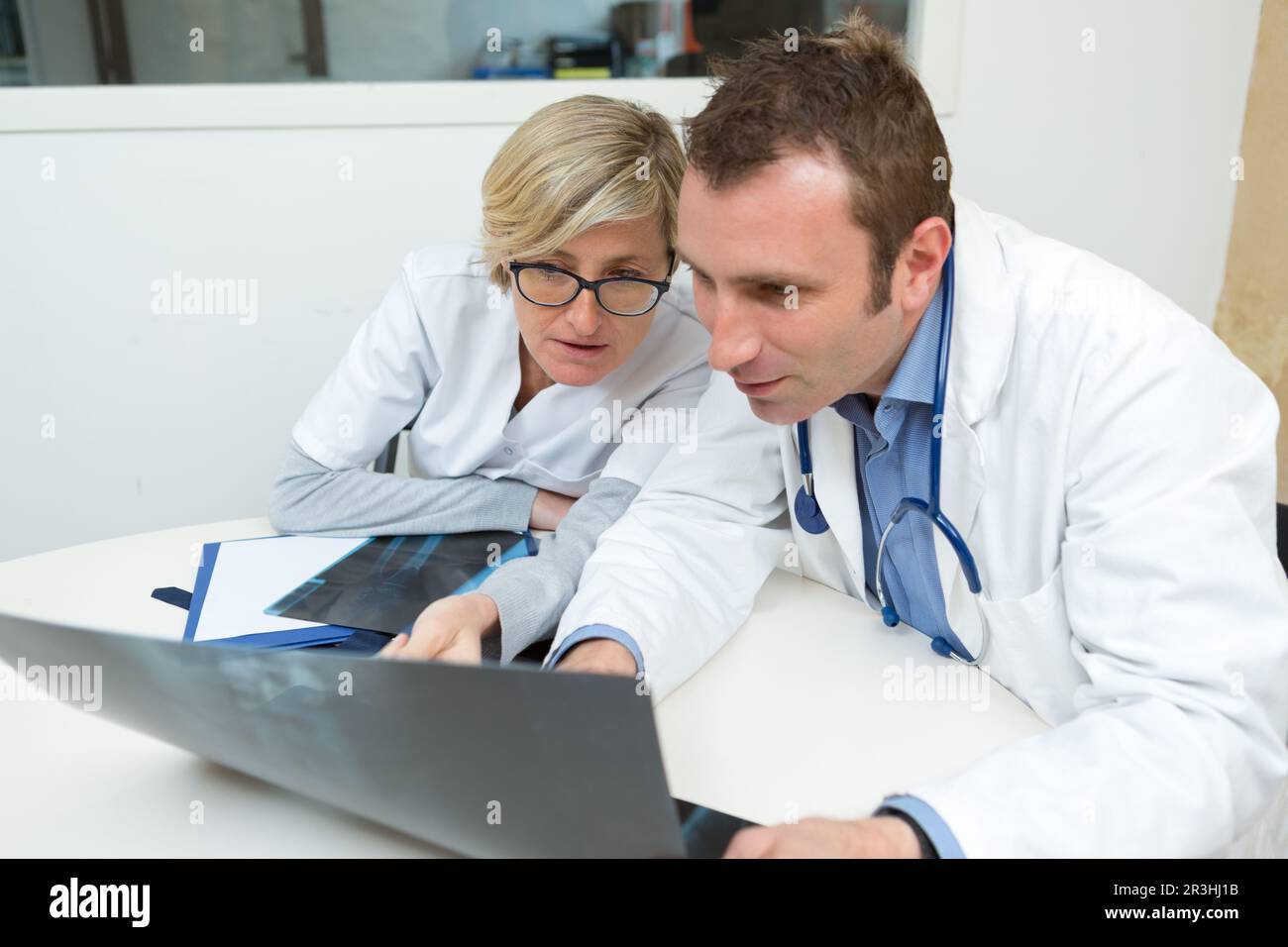 Medical team examining an x ray report hi-res stock photography and ...