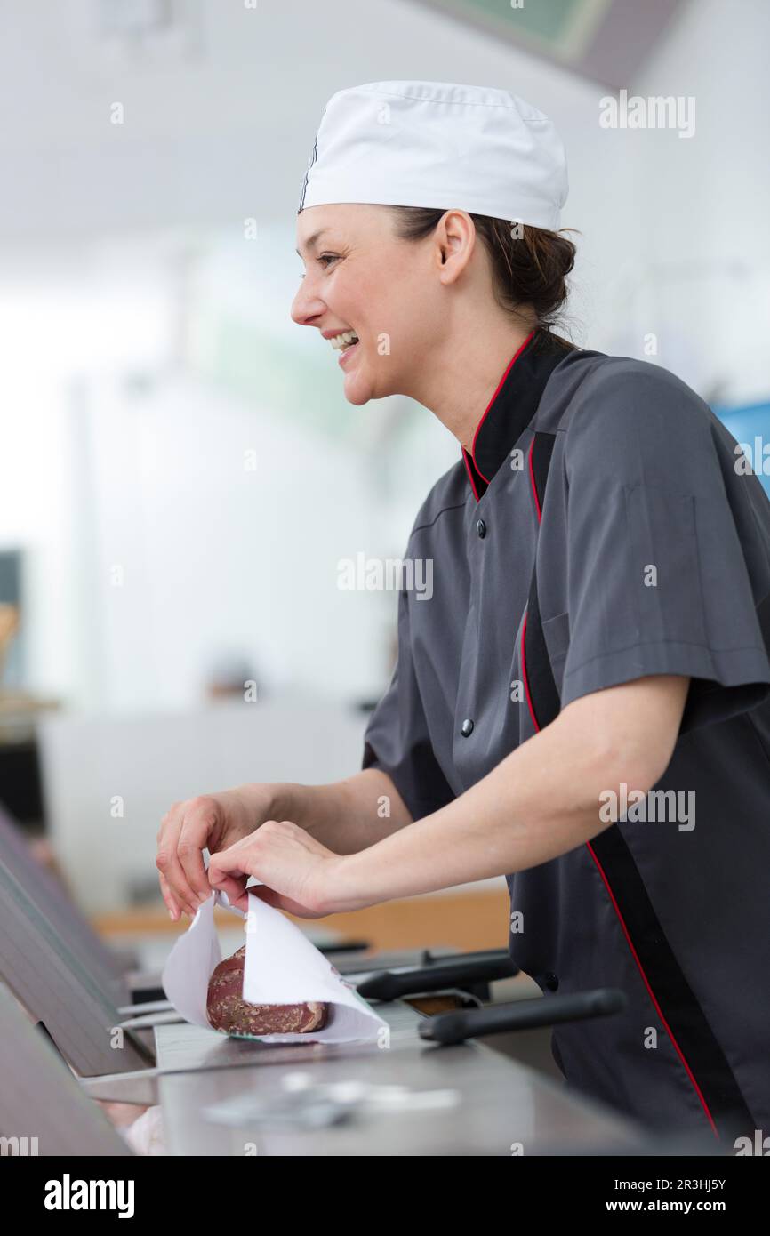 shopkeeper serving a customer in his grocery store Stock Photo - Alamy