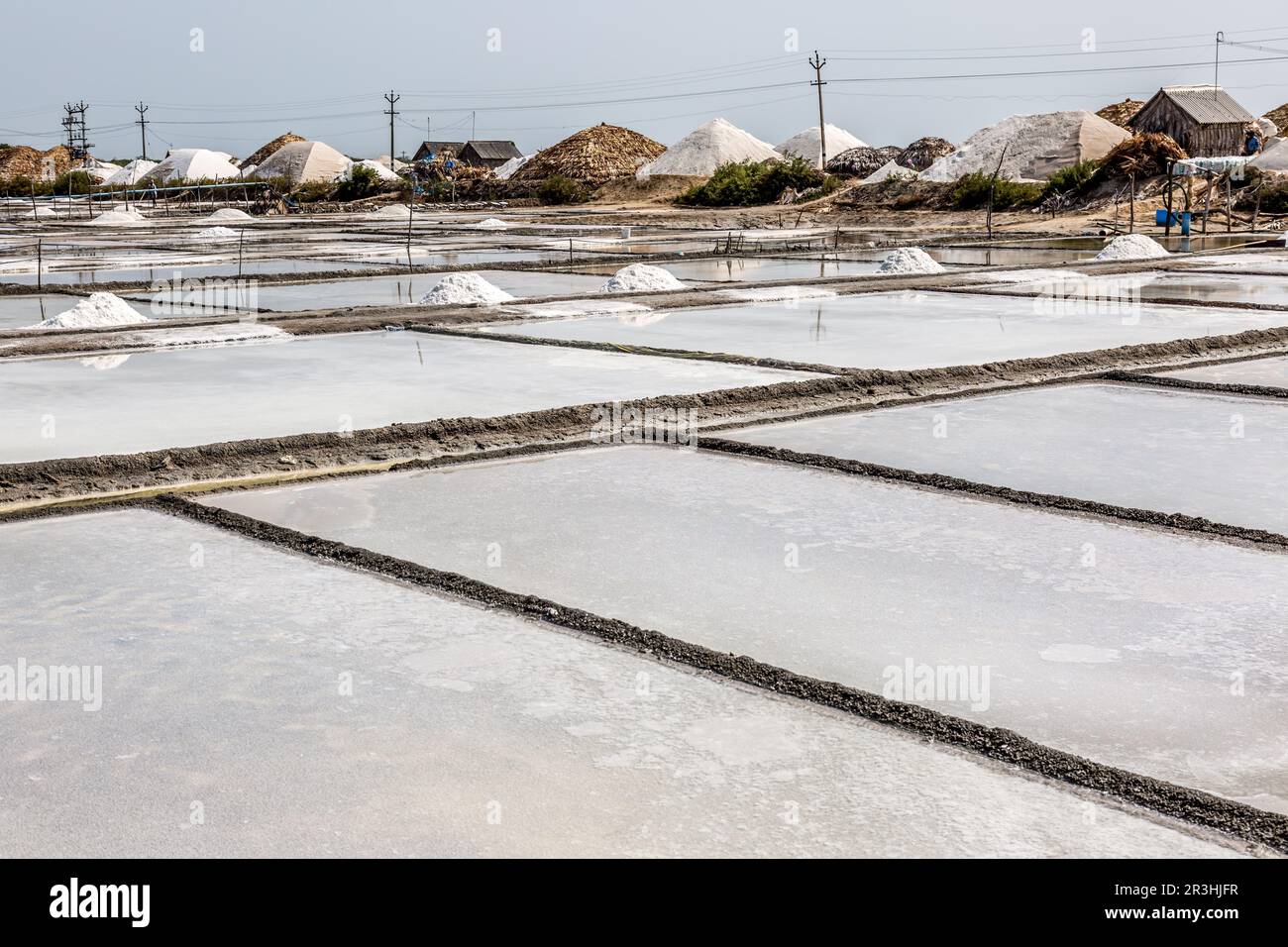 A little section of the sea salt evaporation pond is divided. Side by ...