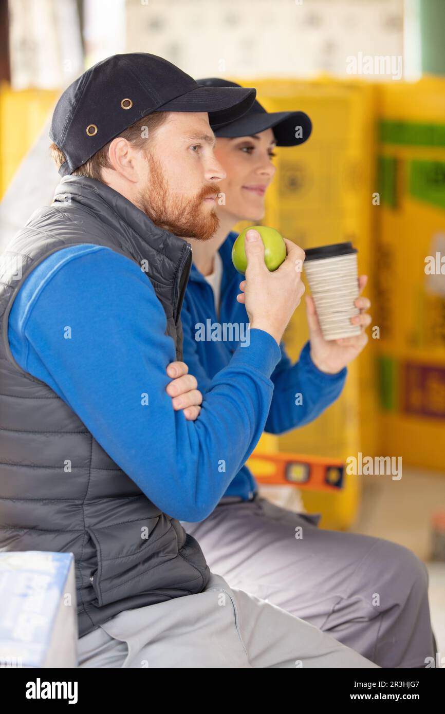 builders having a lunchbreak together Stock Photo - Alamy