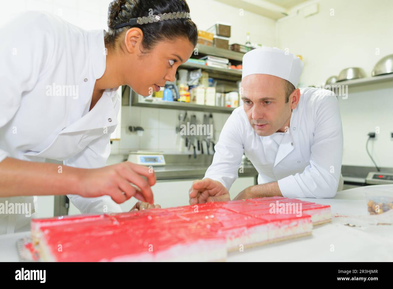 male and female patisserie chefs working at kitchen Stock Photo - Alamy