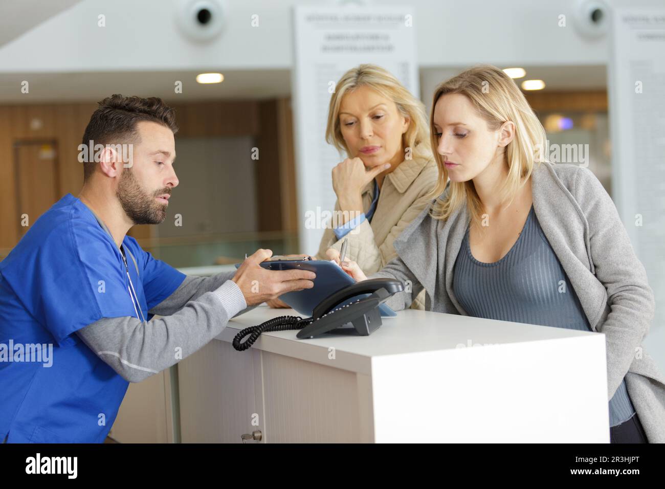 young pregnant woman at a doctors reception Stock Photo - Alamy