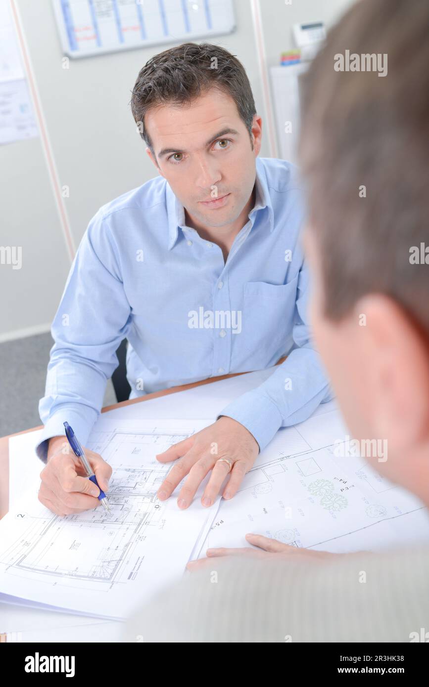 Architect writing on his plans Stock Photo - Alamy