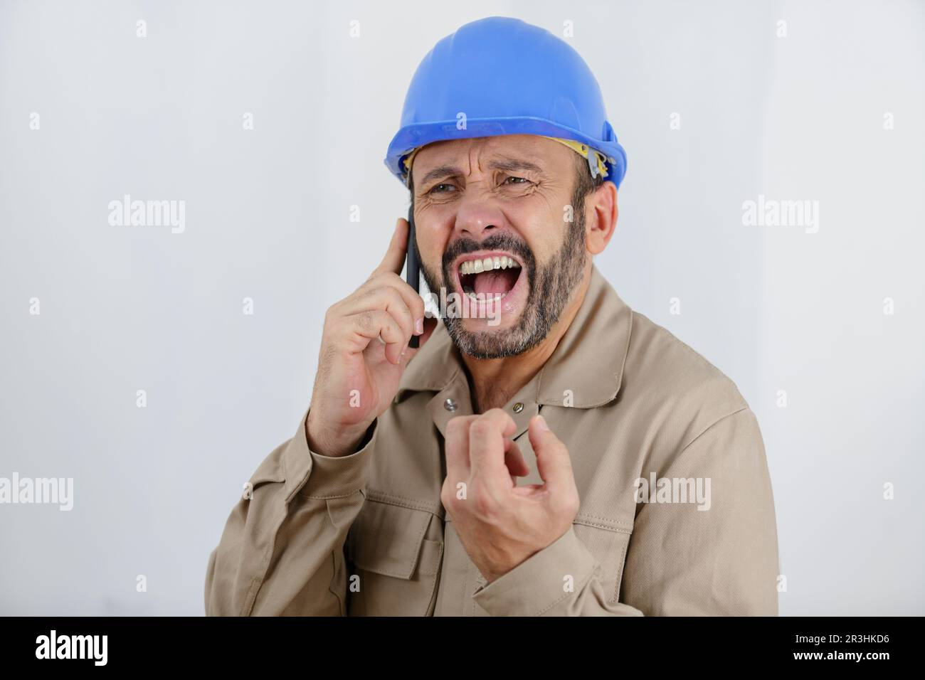 angry builder or constructor yelling at somebody on phone Stock Photo ...