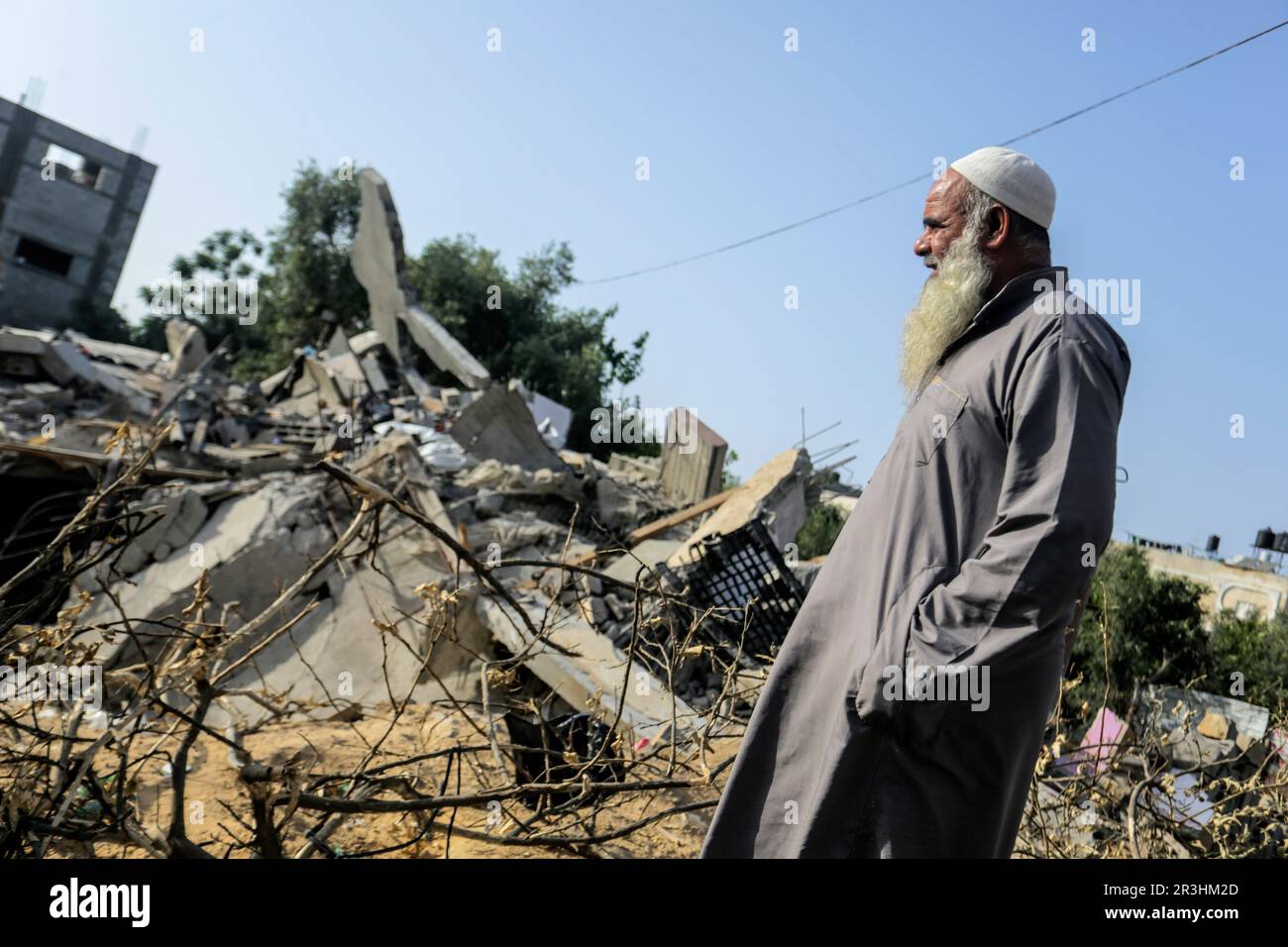 Gaza, Palestine. 23rd May, 2023. A man stands next to rubble of the ...