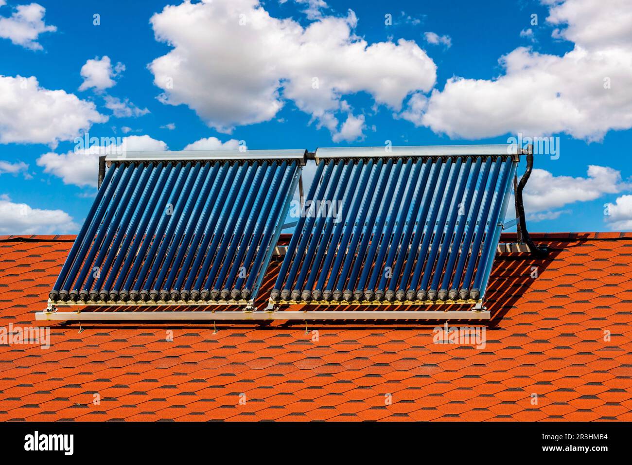 Solar water heater installed on a residential house roof Stock Photo - Alamy