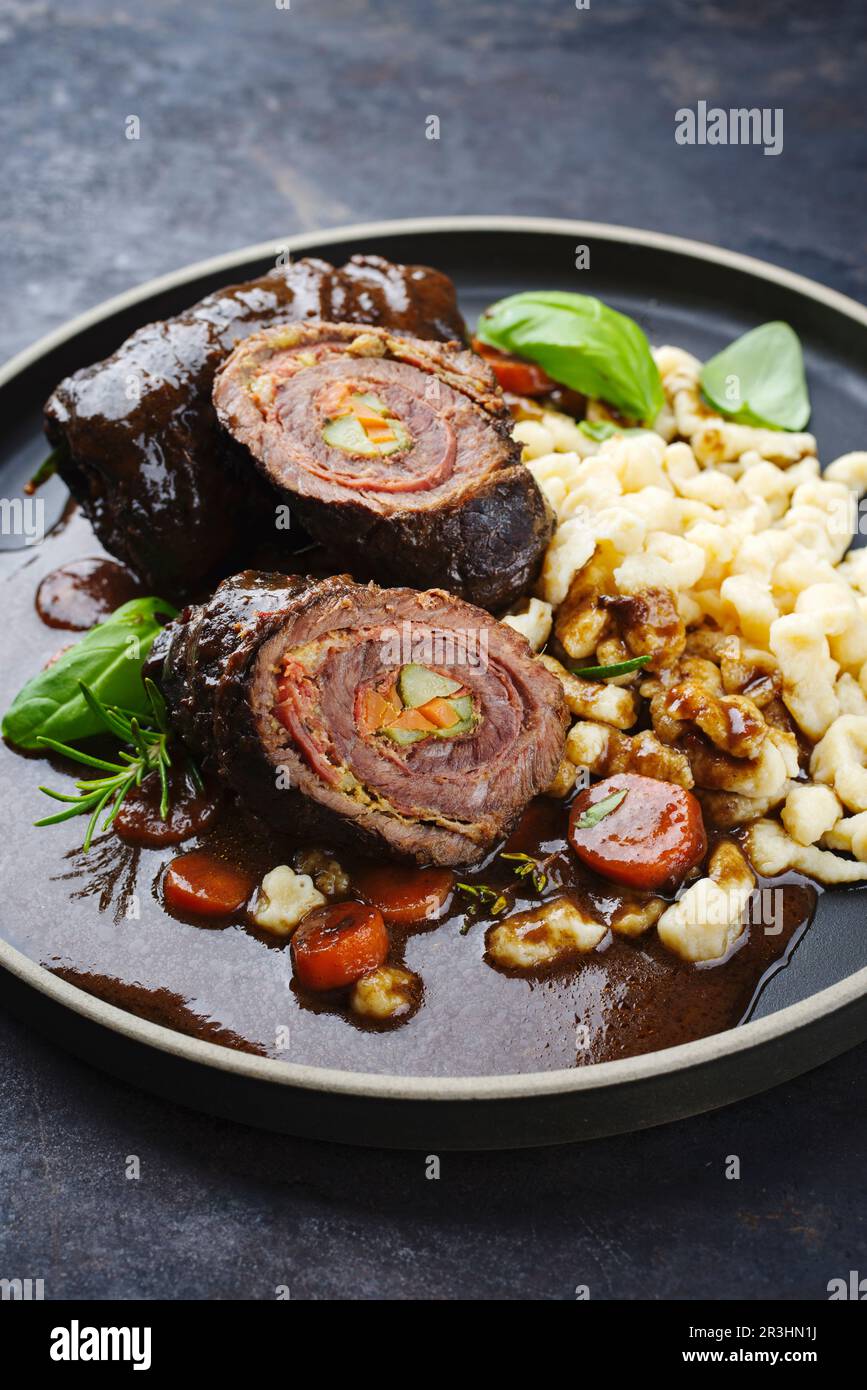 Traditional slow cooked German wagyu beef roulades with spaetzle served ...