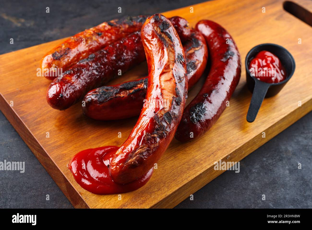 Traditional German barbecue Bratwurst sausages served as close-up on a ...