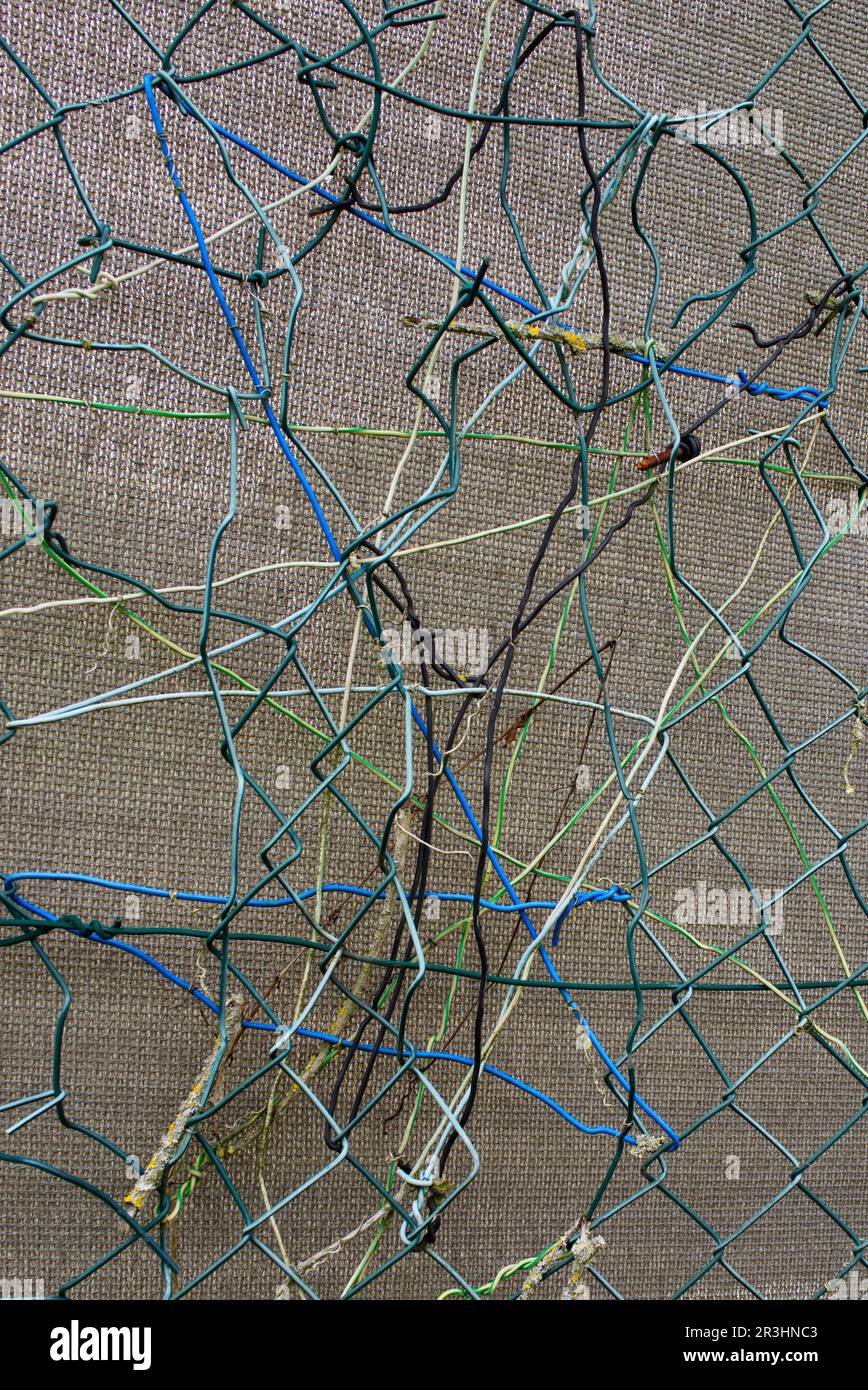 tangle of wires in different colors on a grey textile background Stock ...