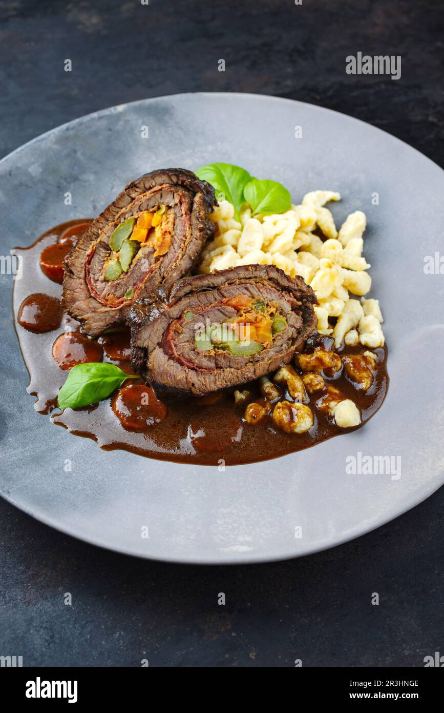 Traditional slow cooked German wagyu beef roulades with spaetzle served ...