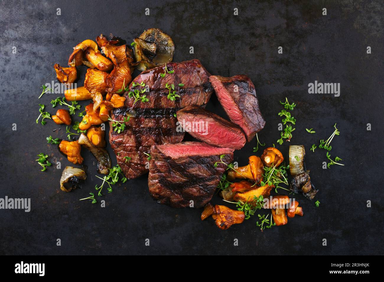 Barbecue angus sirloin beefsteak with chanterelles and onion rings ...