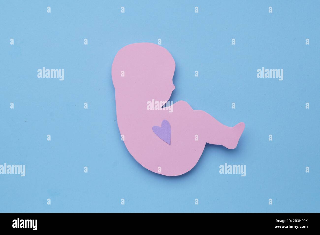 Newborn paper figure on light blue background, top view Stock Photo - Alamy