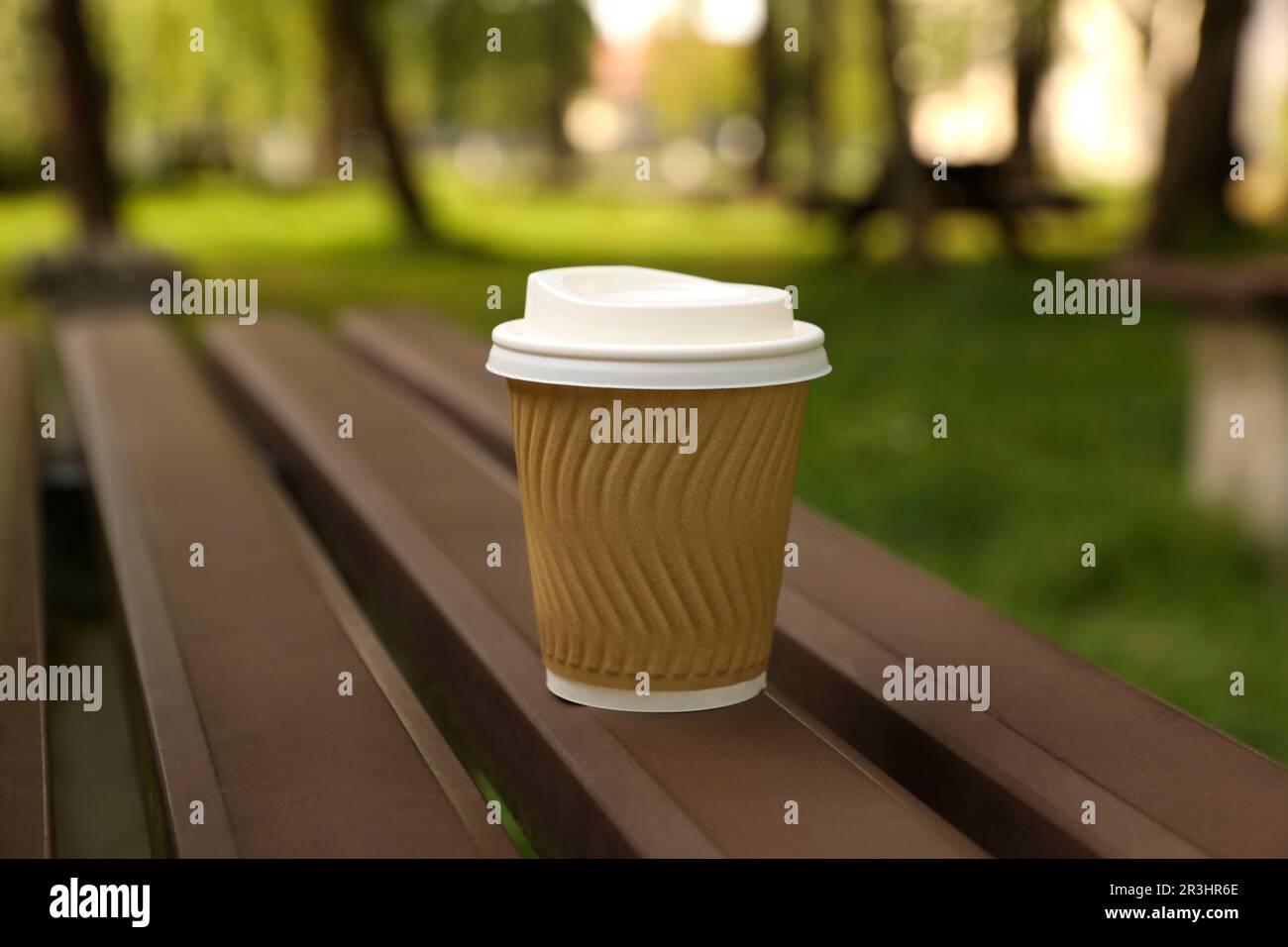 Espresso coffee on a bench in a park hi-res stock photography and ...