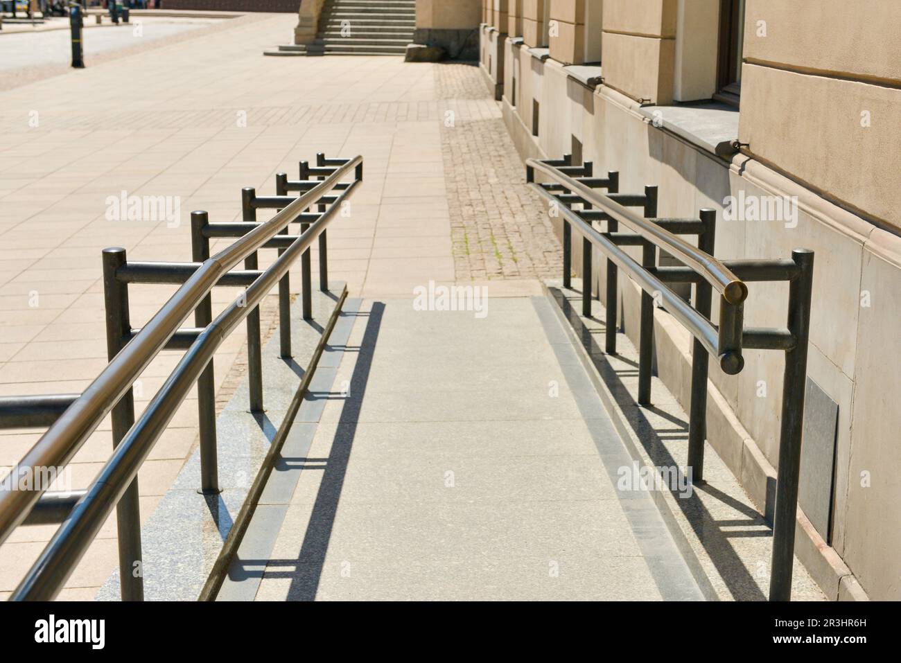 Outdoor stairs with ramp and metal railings Stock Photo - Alamy