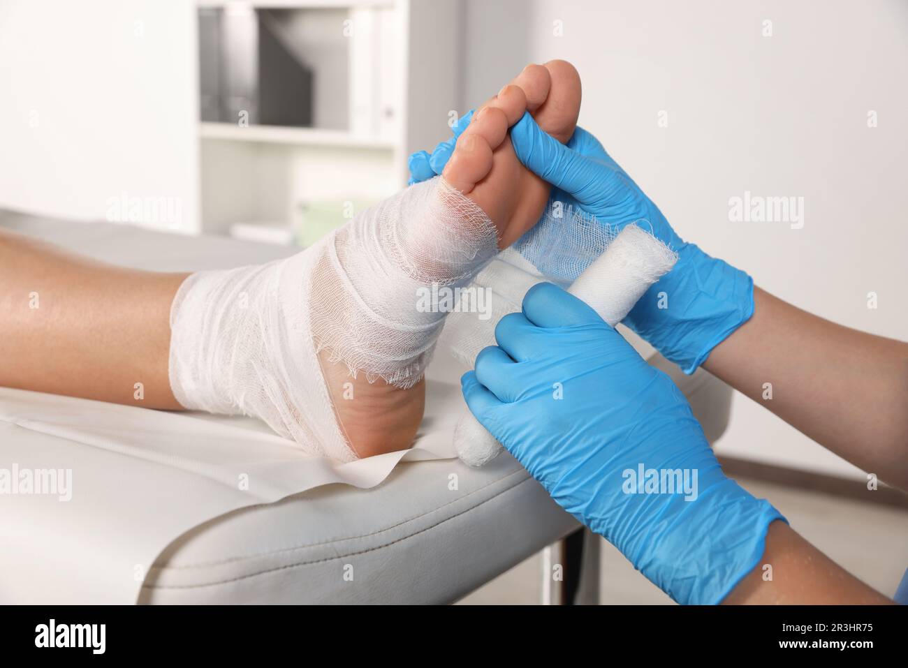 Nurse dressing leg hi-res stock photography and images - Alamy