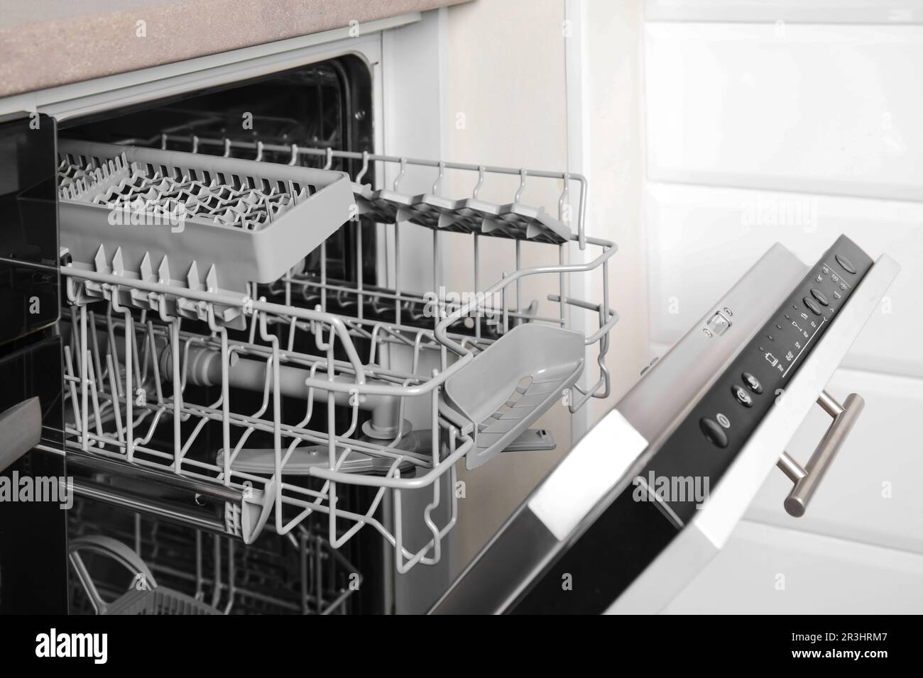 Open clean empty dishwasher in kitchen. Home appliance Stock Photo - Alamy