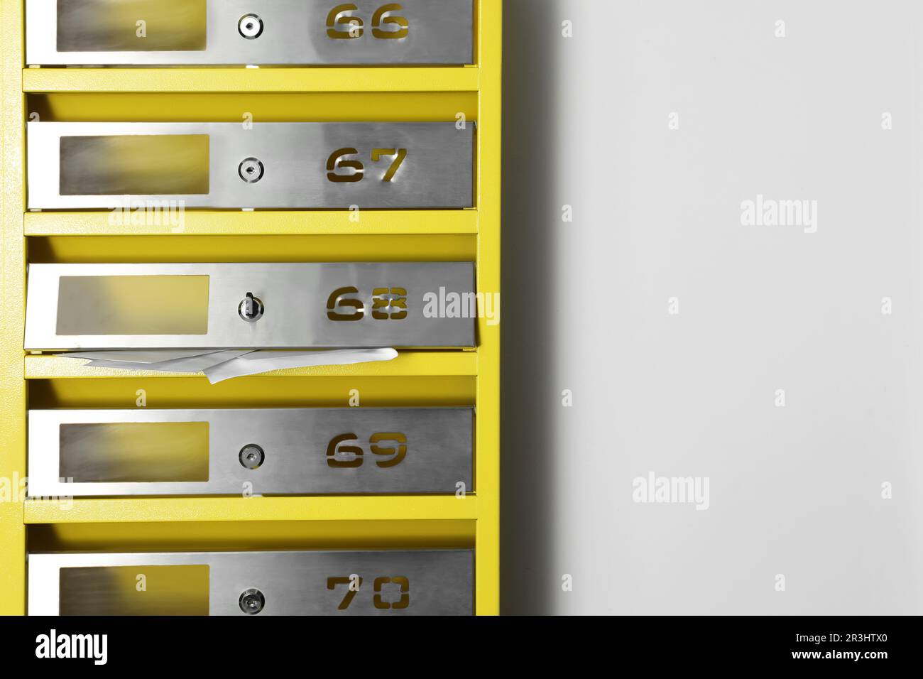 Metal mailboxes with keyholes, numbers and receipts in post office ...