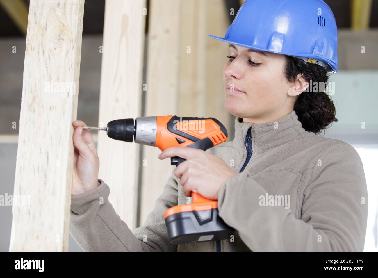 Closeup female carpenter cutting wood hi-res stock photography and ...