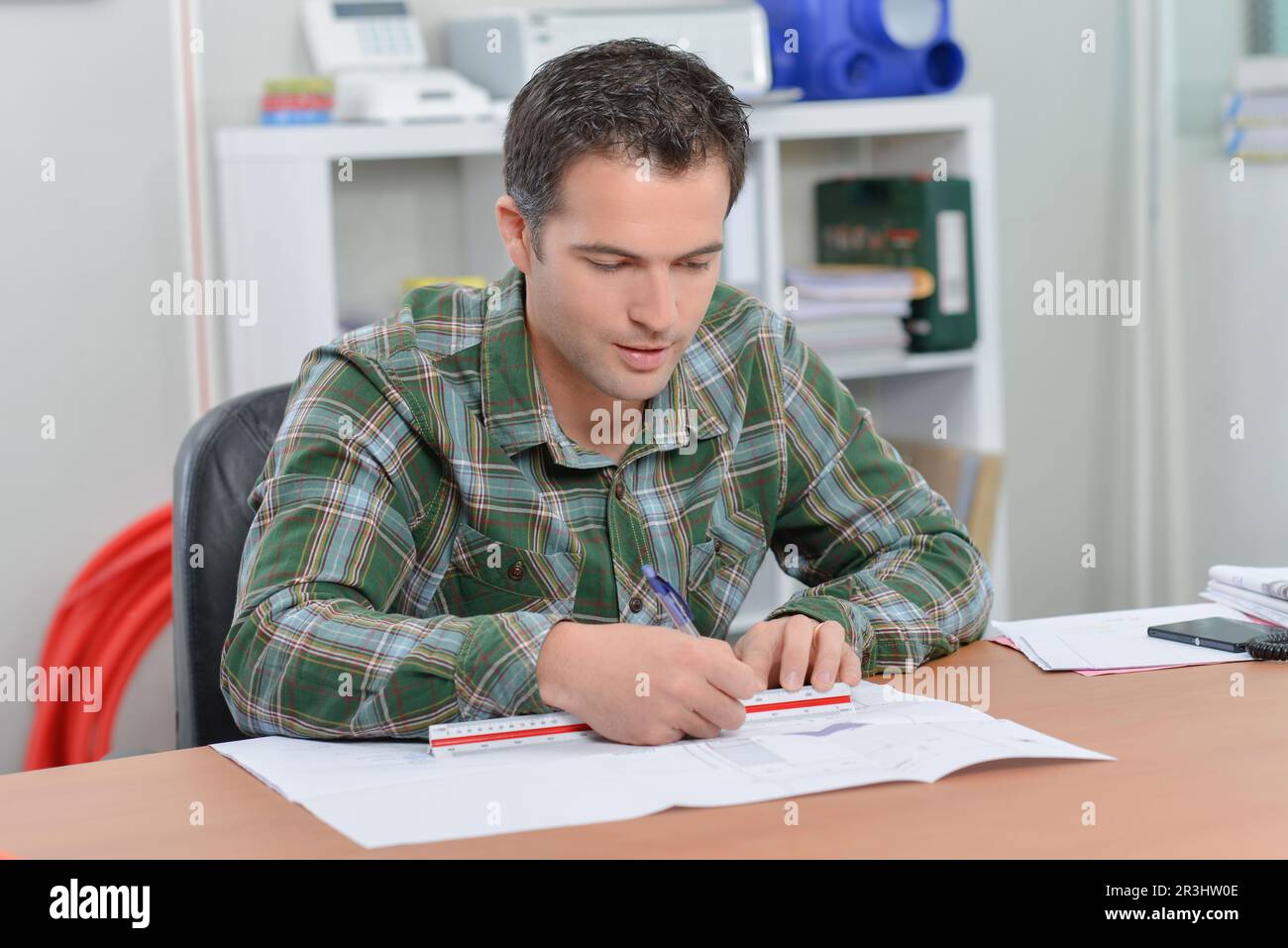 Architect drawing up some plans Stock Photo - Alamy