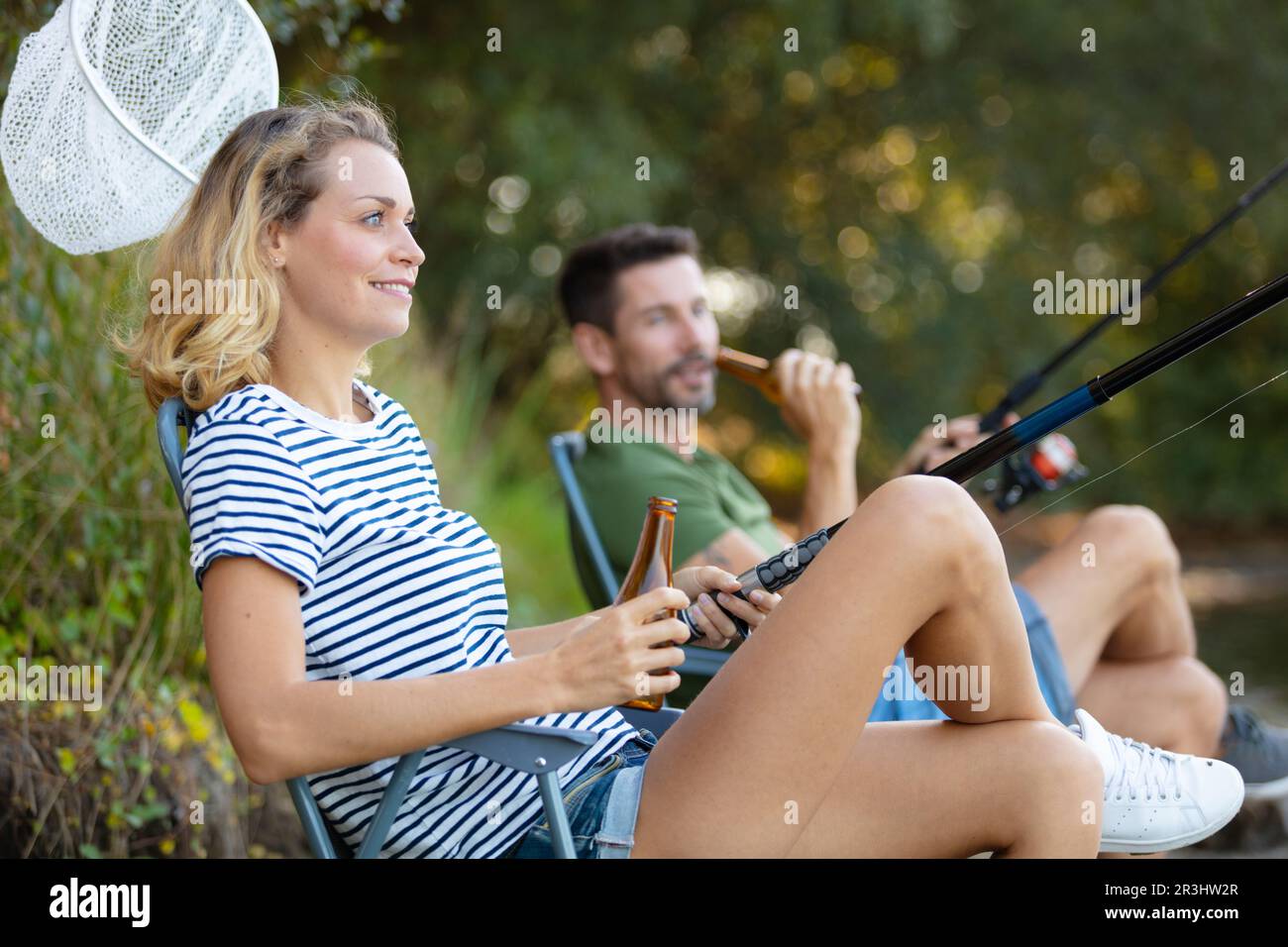 happy couple fishing at the river Stock Photo - Alamy