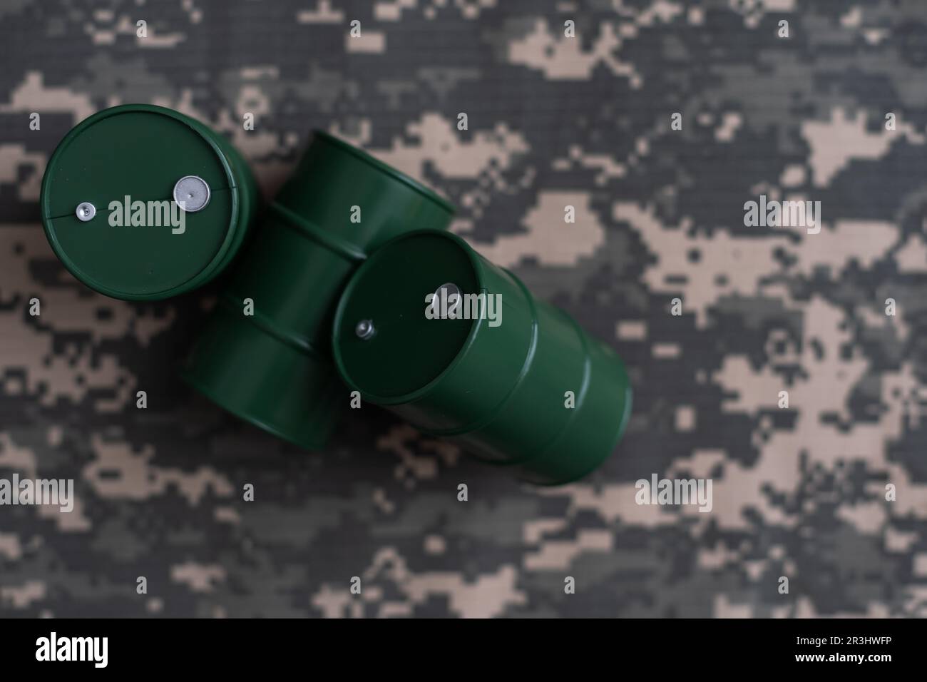 a military uniform and a toy barrel oil Stock Photo - Alamy