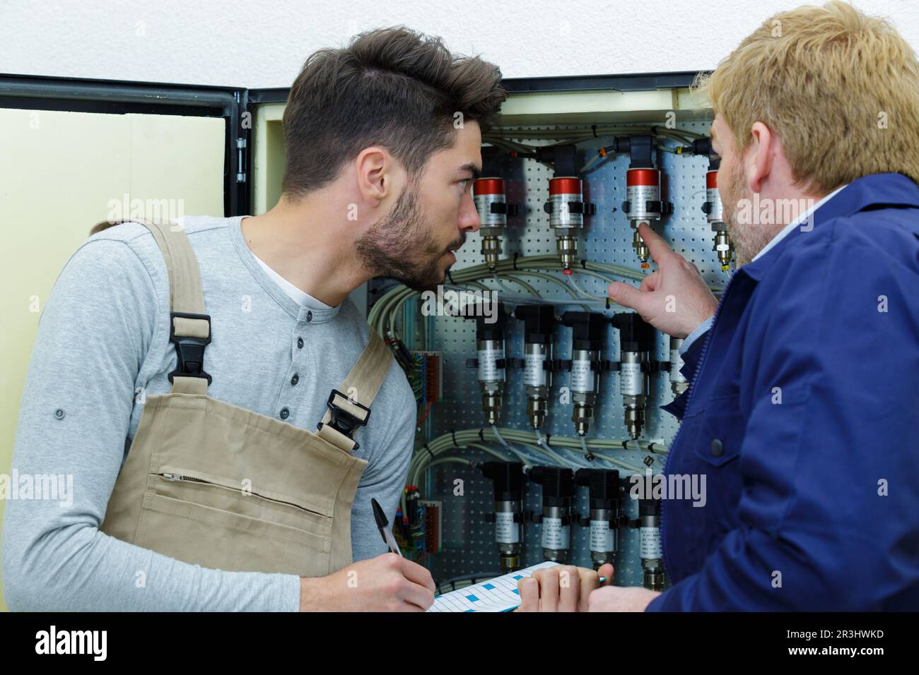 electricians checking state of cables Stock Photo - Alamy