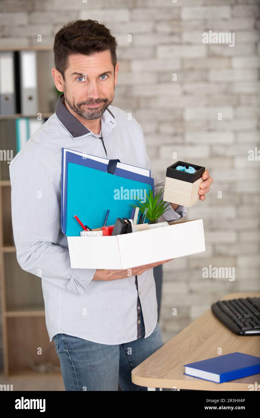 Businessman leaving office box personal hi-res stock photography and ...
