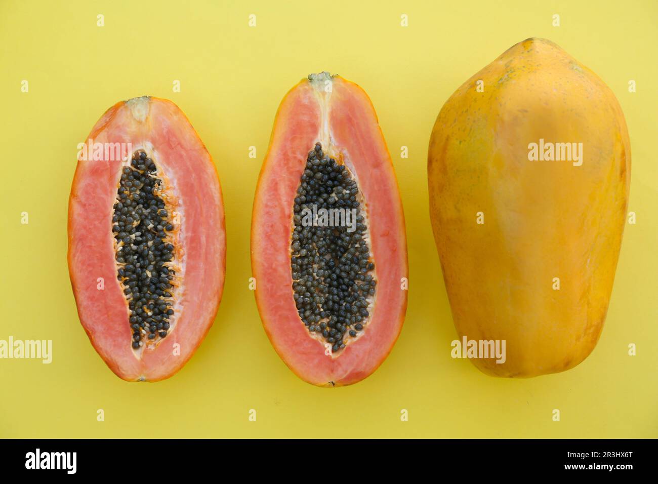 Fresh ripe cut and whole papaya fruits on light green background, flat ...