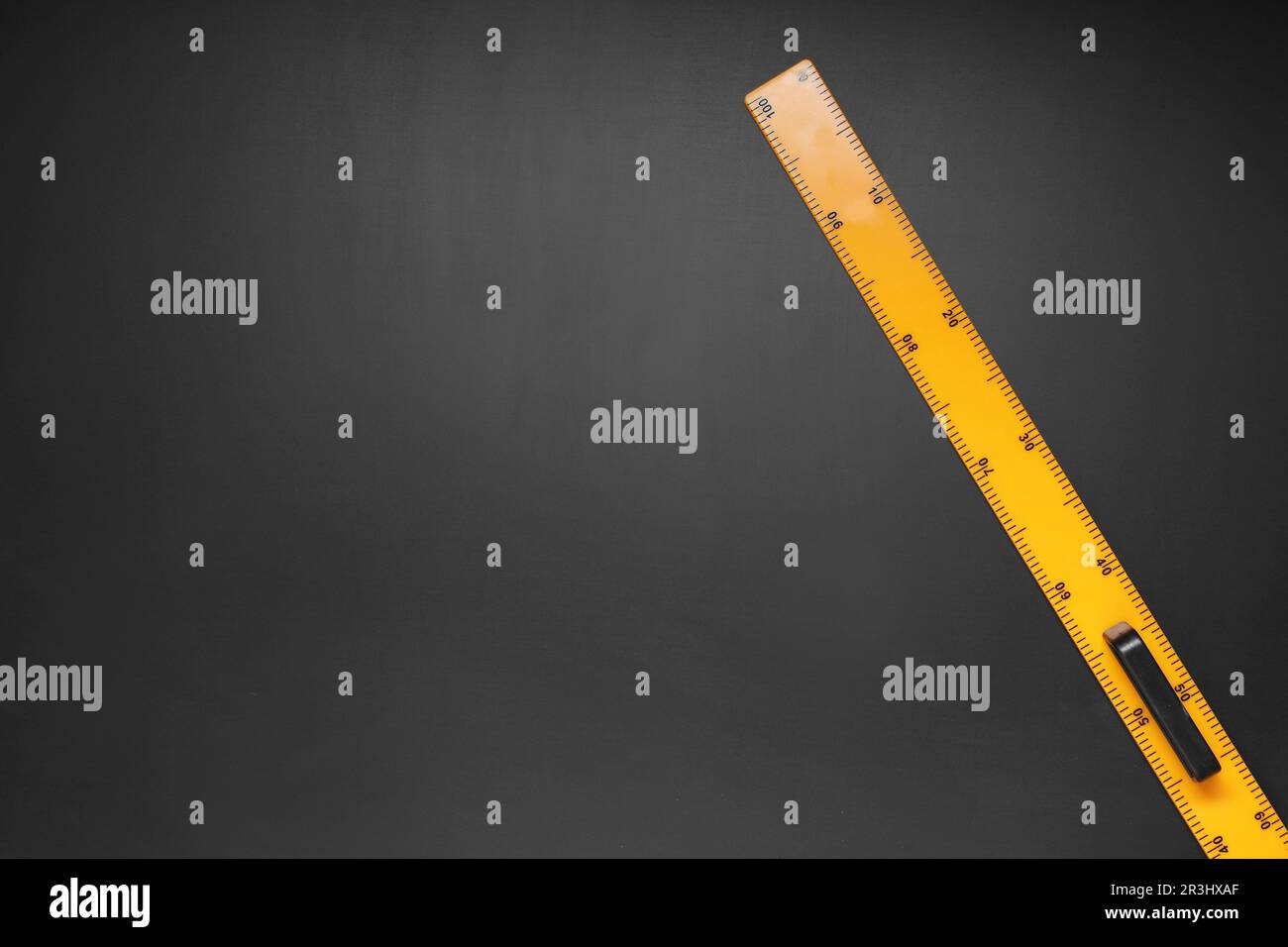 Yellow school ruler on blackboard, top view. Space for text Stock Photo ...