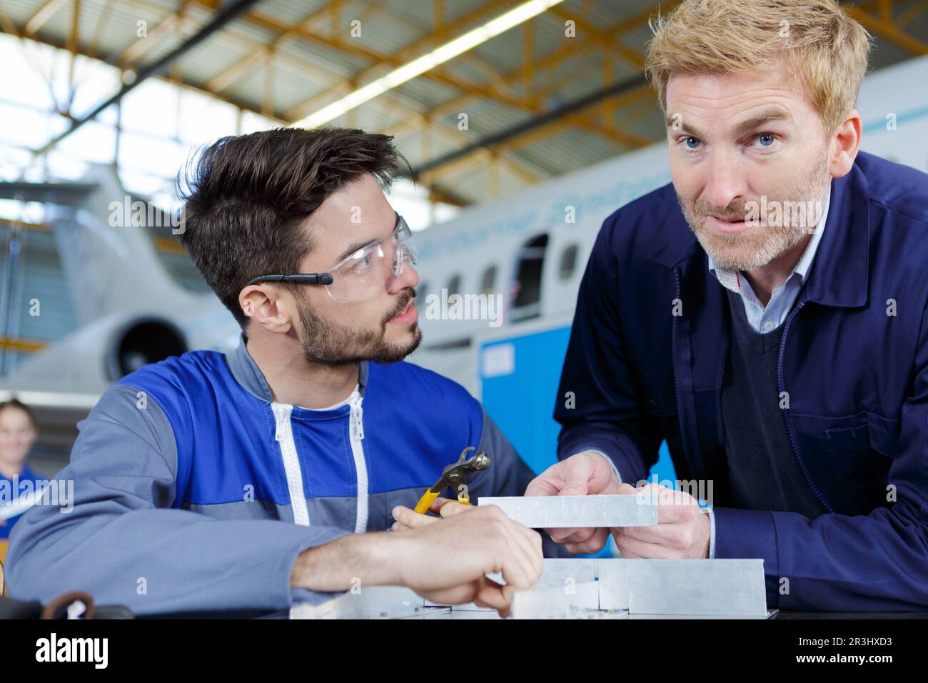 apprentice aerospace engineer talking to his superior Stock Photo - Alamy