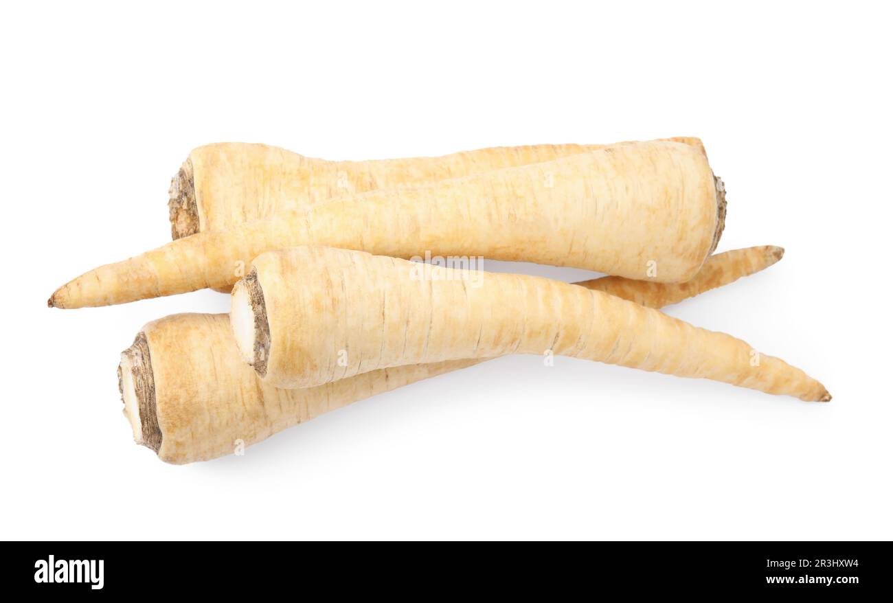 Raw parsley roots isolated on white, top view Stock Photo - Alamy