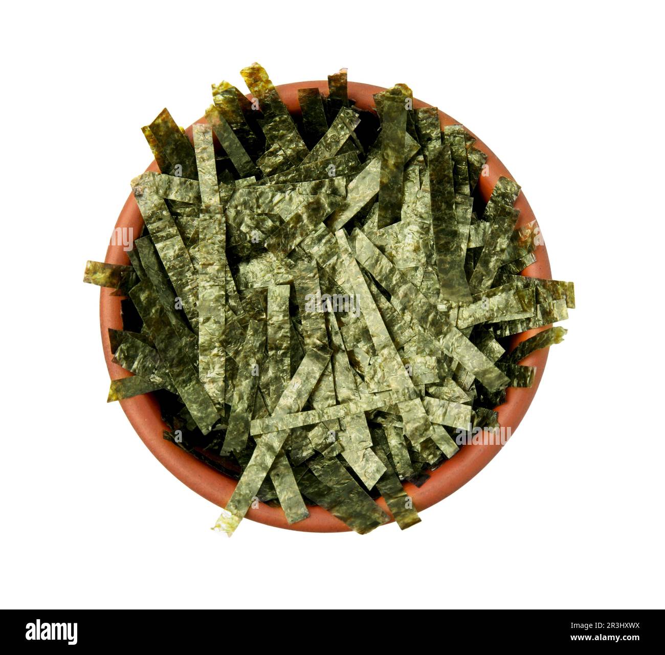 Bowl with chopped crispy nori sheets isolated on white, top view Stock ...