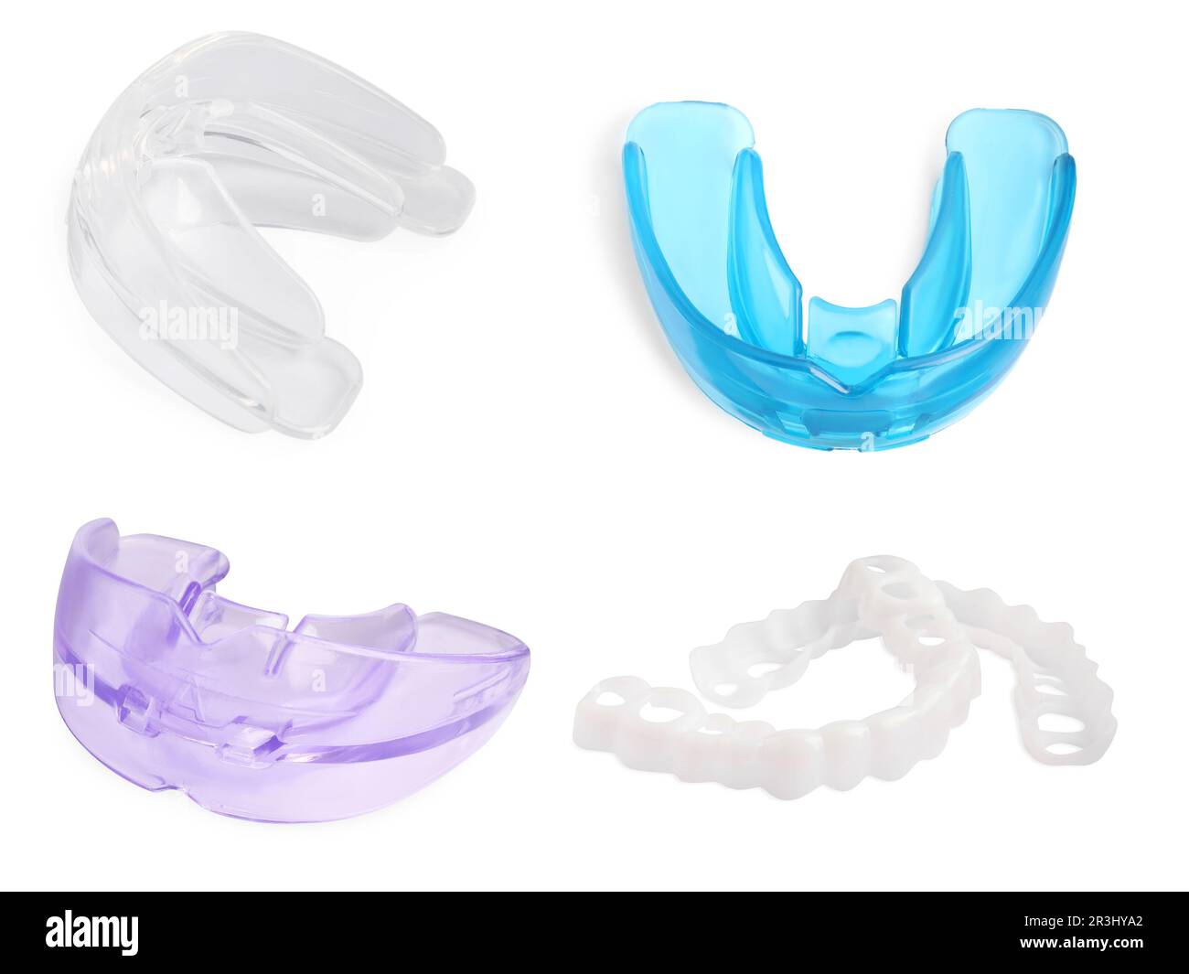 Set with different mouth guards on white background. Bite correction ...
