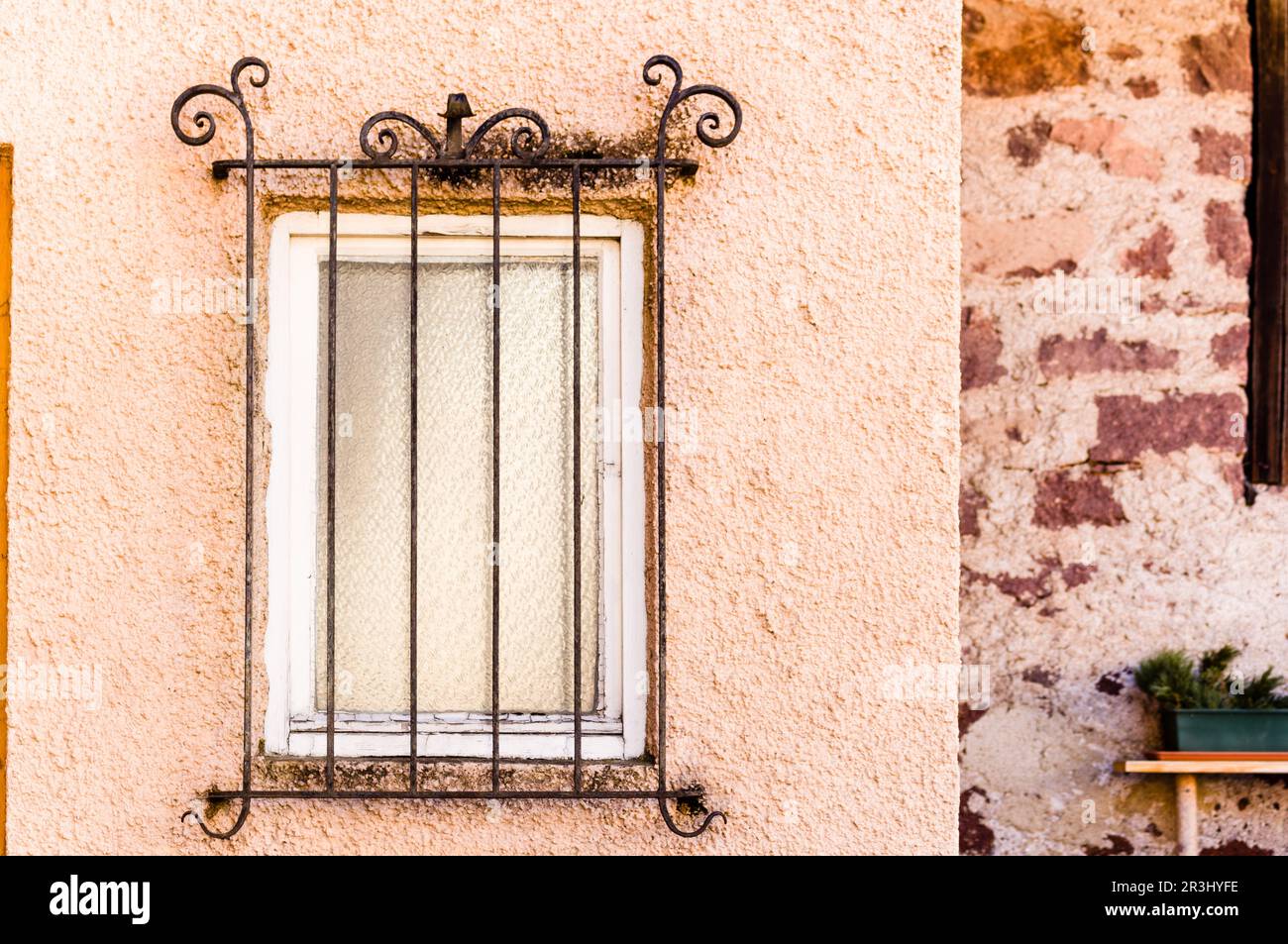 Squared glass window with iron grate with stylized curly Stock Photo ...