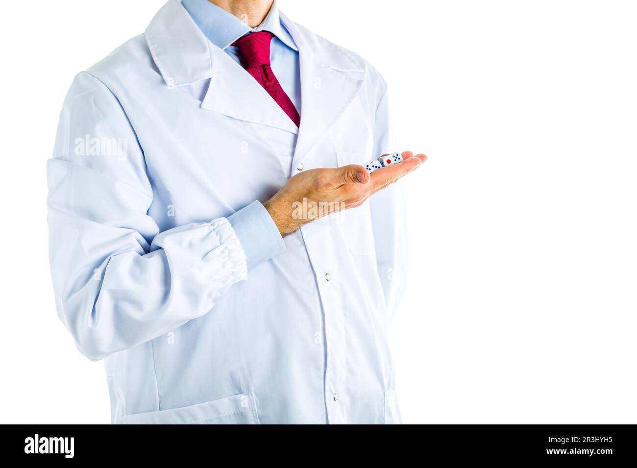 Doctor in white coat holding dice Stock Photo - Alamy