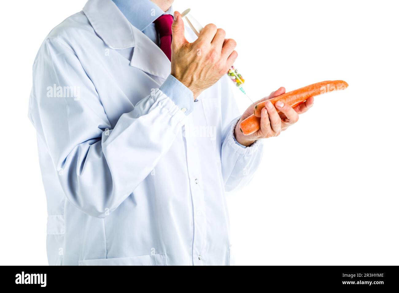 Doctor in white coat making an injection to orange carrot Stock Photo ...
