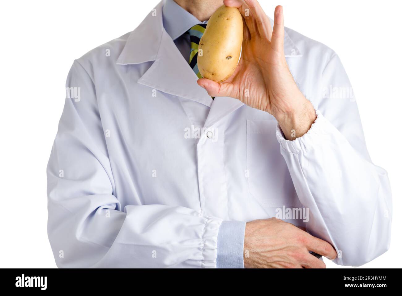 Man in medical white coat showing potato Stock Photo - Alamy