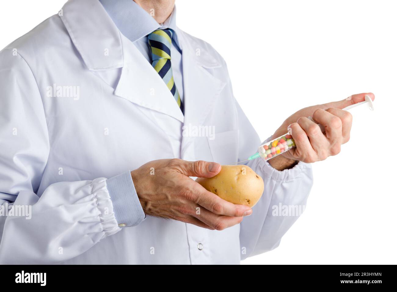 Man in medical white coat makes an injection to potato Stock Photo - Alamy